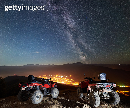 Atv quad motorbikes in the mountains under night starry sky (1128633154 ...