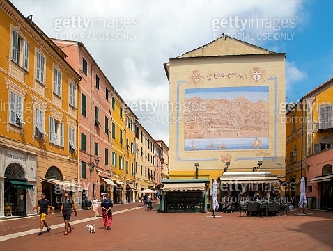 View of the main square of the old sea village of Oneglia in a sunny ...