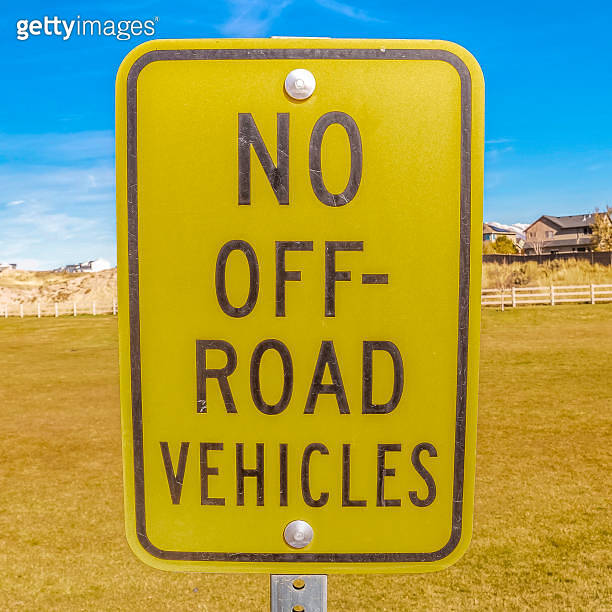 Square frame Road sign on a grassy field - No Off-road vehicles ...