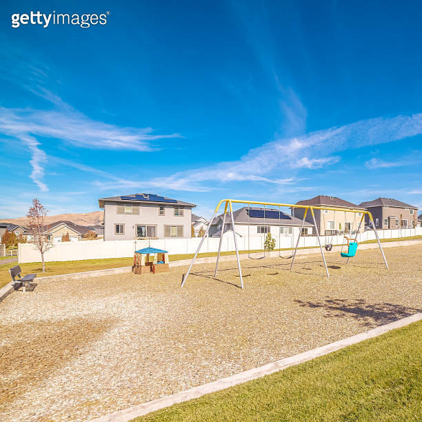 Square Kids entertainment area with swings in playground 이미지 ...