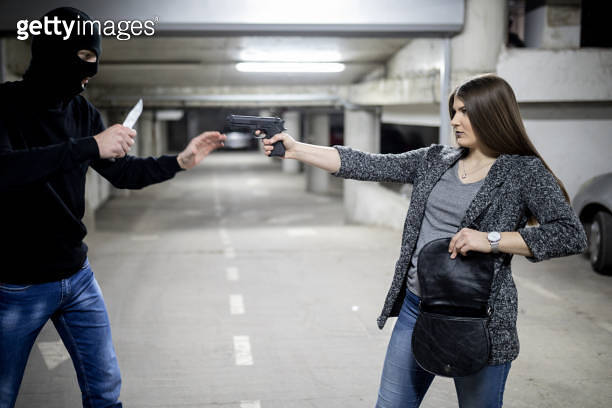 Woman with gun for self defense 이미지 (1161194260) - 게티이미지뱅크