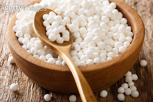 Organic tapioca pearls close-up in a bowl on a table. horizontal ...