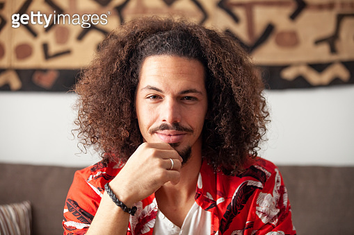 Portrait of an exotic and handsome cuban young man smiling to the ...