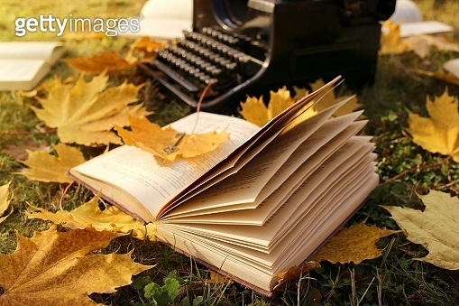 Writing Concept.Autumn Books. black typewriter and books with yellow ...