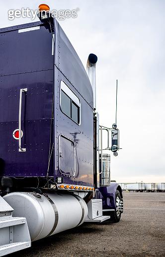Dark blue big rig classic semi truck tractor with aluminum accessories ...