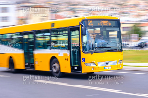 Yellow bus driving on the street in Funchal on Madeira island. Photo ...