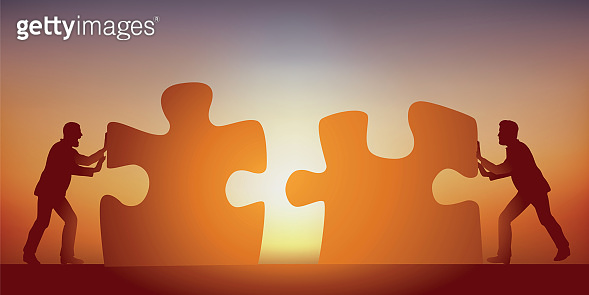 Concept of the union that makes strength, with two men who unite their ...