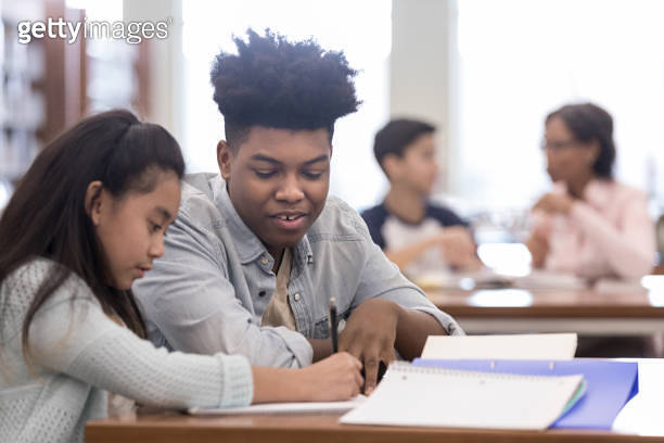 Hispanic student gets extra math help from African American teen ...