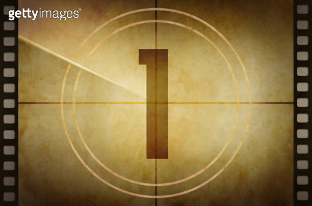 Vintage old film projector countdown screen with the number 1 at the ...