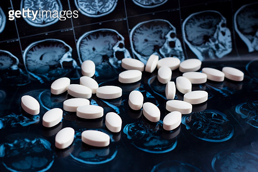 Pharmaceutical medicine pills on magnetic brain resonance scan mri ...