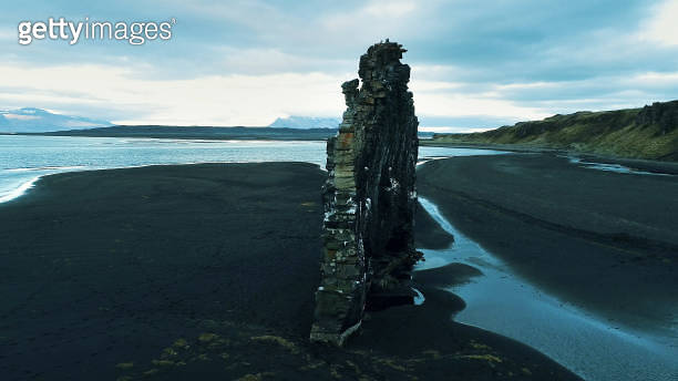 Hvitserkur - iconic sea stack on volcanic black beach. Aerial view ...