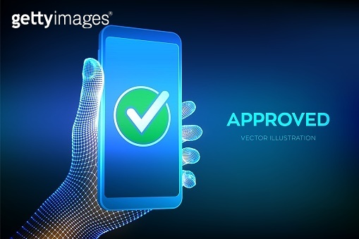 Approved. Check mark. Hand holding a smartphone with a green checkmark ...