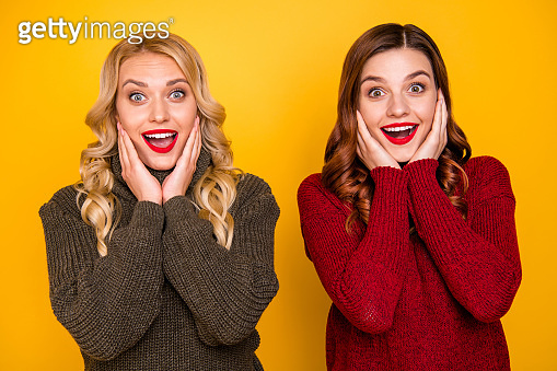Two amazing ladies not believe eye holding arms on cheekbones wear warm ...