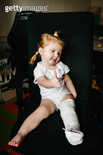 Child with bandage on leg heel fracture. Broken left foot, bone, calf ...