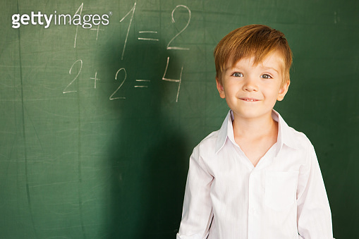 The boy solved arithmetic equations at school. A child writes on the ...