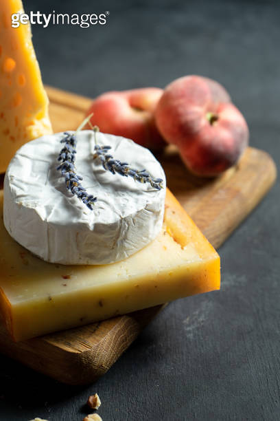 Close up view on cheese on dark background. Camembert, cheese with ...