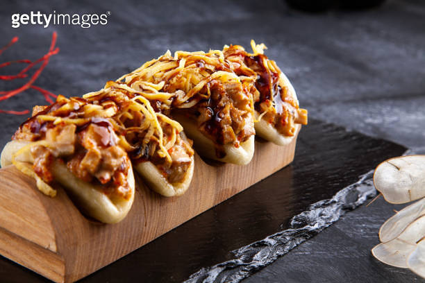 Close up on Gua bao, steamed buns with meat (veel). Bao served with ...