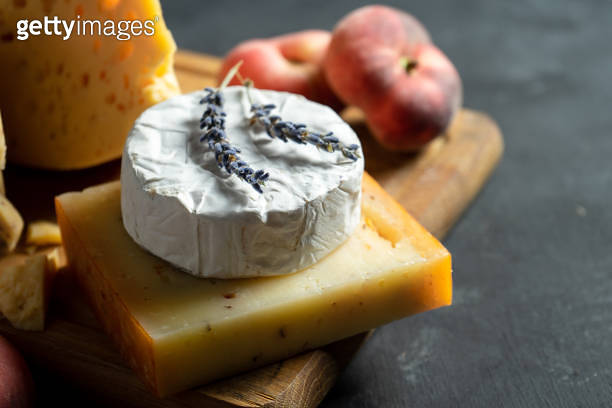 Close up view on cheese on dark background. Camembert, cheese with ...