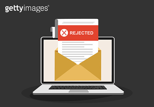 Laptop and envelope with rejected letter. Email with rejected header ...