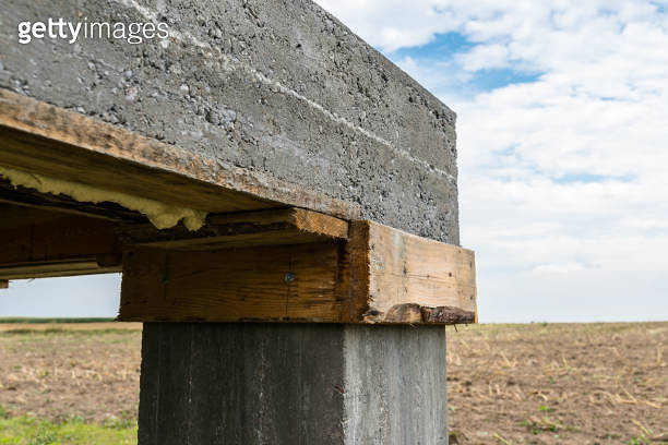 Reinforced concrete slab in the shape of a rectangle on concrete poles ...