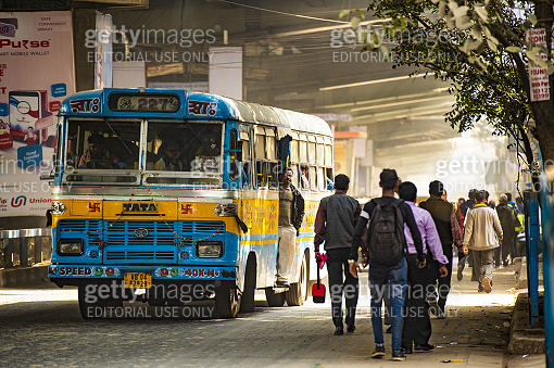 City life with bus and taxi on the streets of Kolkata, India. Kolkata ...
