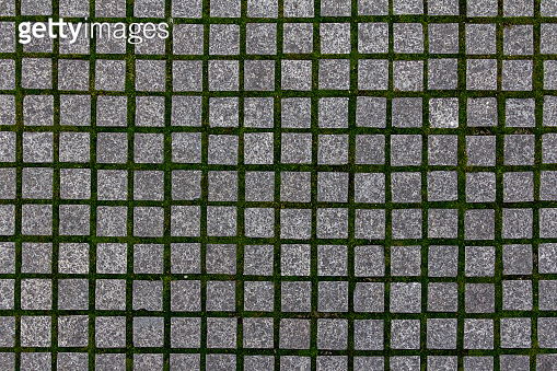 Old cobblestone tile texture in old town. City pavement background ...