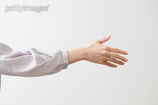 Hand of a woman seeking a handshake (1173752378) - 게티이미지뱅크
