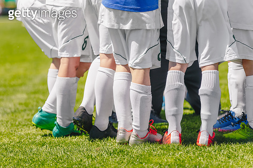 Soccer school tournament. Group of children on sports venue. Legs of ...