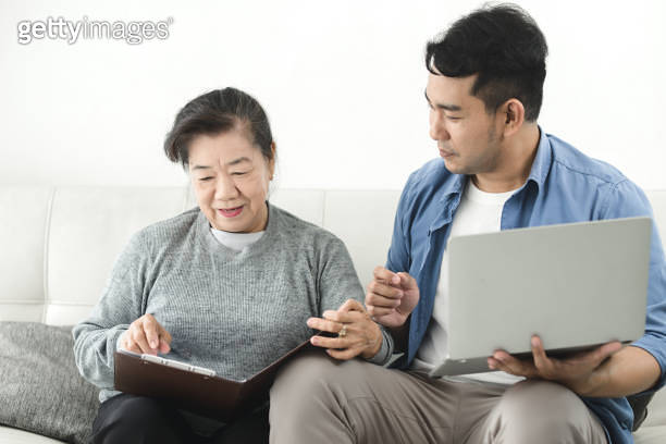Asian agent man deal with senior for life insurance contract signed ...