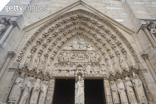 The Red Door of Gothic cathedral in West Portals Facade of Notre Dame ...