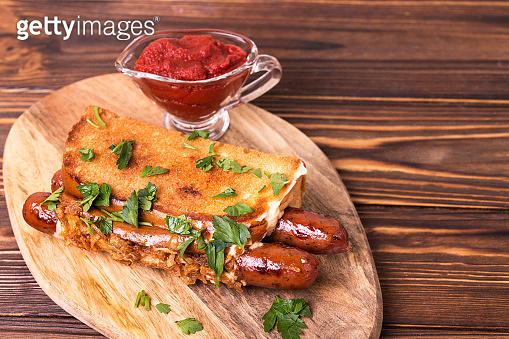 Double hot dogs with french brioche buns and caramelized onions ...