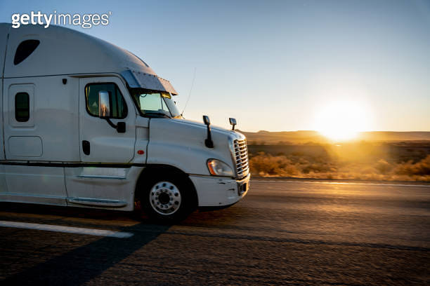Closeup Side View Of A Semi Truck Cab Driving On A Two Lane Highway In ...