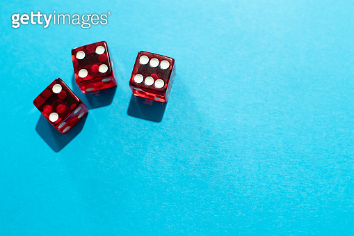 Pair numbers. 3 transparent red dice on a light blue background ...
