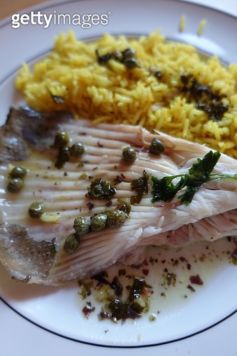 Ray wing sea fish cooked in a court-bouillon then in butter in a pan ...