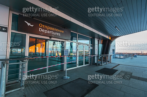 Side view of closed glass doors at the entrance to the Pulkovo airport ...