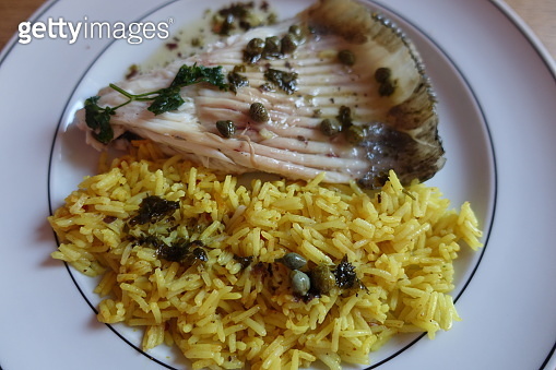 Ray wing sea fish cooked in a court-bouillon then in butter in a pan ...
