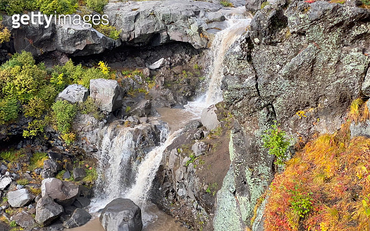 Close-up of amazing two-stage waterfall. Stunning autumn landscape ...