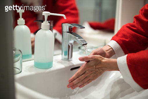 Close-up of Adult Woman in Santa Costume Washing Hands in Bathroom 이미지 ...