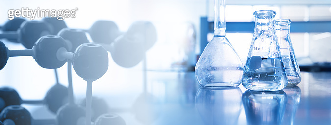 water in flask with molecular structure science equipment in laboratory ...