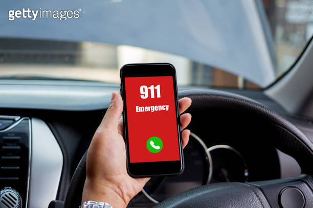 Hand holding cell phone with emergency number 911 in car (1288812866 ...