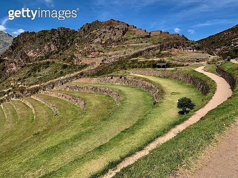 Green grass terraces fields of Incas Empire on hilltop in Sacred Valley ...