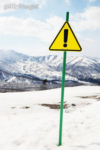 Yellow warning sign with an exclamation sign. Exclamation sign post ...