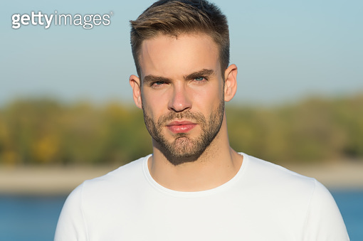 Preparing for sunny days. Handsome man outdoors. Summer skincare ...