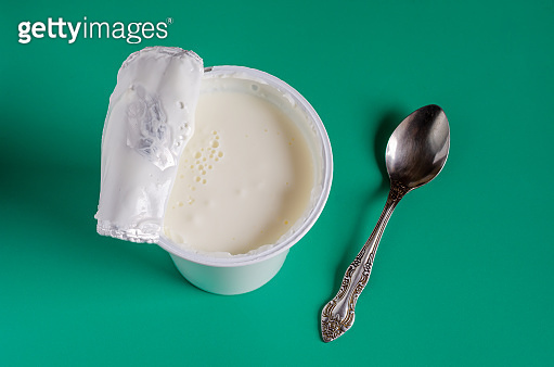 Tasty yogurt in an open plastic glass. 이미지 (1207113048) - 게티이미지뱅크