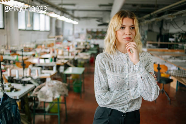 The director of the textile industry works in a factory, controls ...