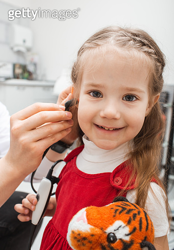 Tympanometry for child. Hearing testing for a little girl patient using ...