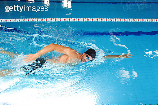 Man swimmer is swimming in the pool. Freestyle stroke, front crawl ...