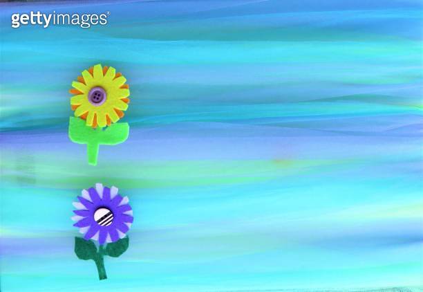 Flowers bordering blue variegated background; Felt art craft; Copy ...