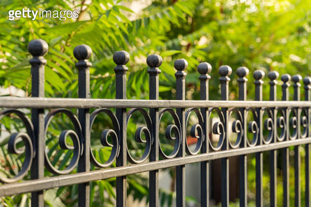 Beautiful decorative cast metal wrought fence with artistic forging ...