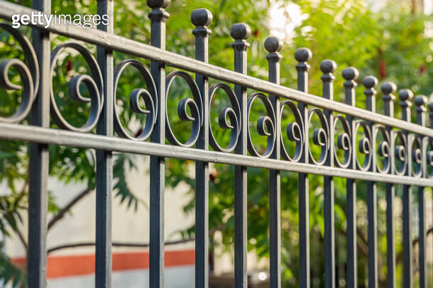 Beautiful decorative cast metal wrought fence with artistic forging ...